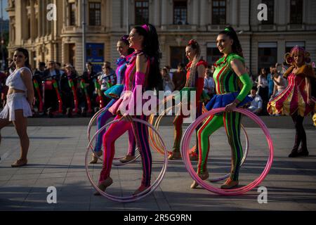 Artists of the Metropolitan Circus offer a street performance in ...