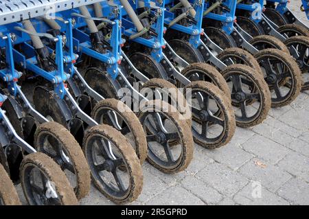 Agriculture: Wheels of a seed drill Stock Photo - Alamy