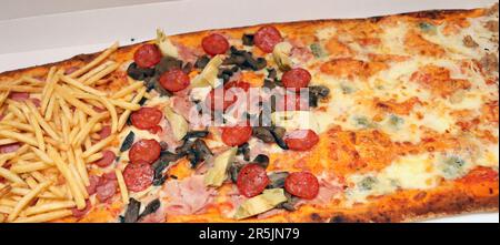 huge long pizza with tomato cheese mozzarella spicy salami mushrooms in ...