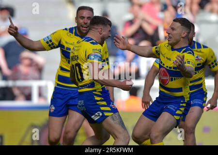 Connor Wrench #20 of Warrington Wolves goes over for a try during the ...