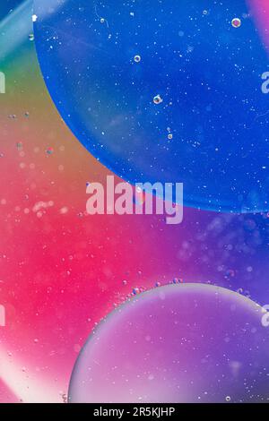 Oil floating on water Stock Photo - Alamy