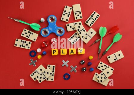 Components of board games and blocks with word Play on red background ...