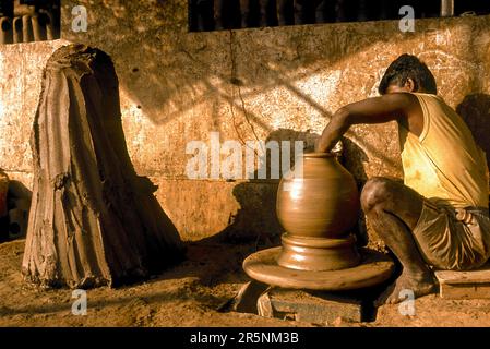 A man making Ghatam percussion instrument at Manamadurai, Tamil Nadu ...