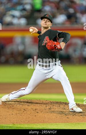 Arizona Diamondbacks starting pitcher Ryne Nelson throws to the plate during the first inning of ...