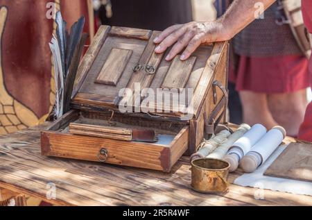 Roman scribe writing on wax tablets. A scribe is a person who writes ...