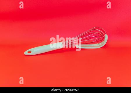 The Green-Handled Manual Egg Beater is a versatile kitchen tool that ...