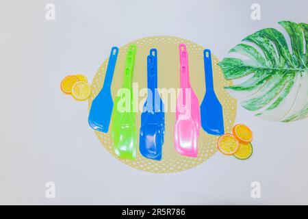 The Colorful Plastic Spatula Set includes spatulas in vibrant shades of ...