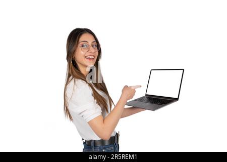 Woman holding laptop with empty mock up screen. Portrait of a young ...