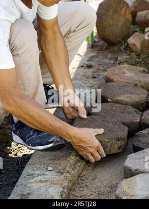 Construction site of pavement octagon bricks road. Installation or ...