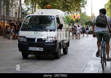 The minivan Piaggio Porter driving through Barcelona, Spain Stock Photo ...
