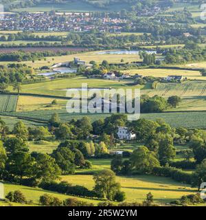 Fields and large houses, including the modernist Swinhay House, fill ...