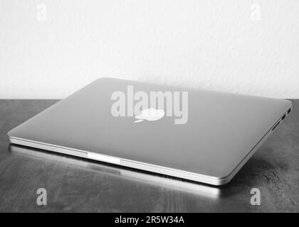 A grayscale shot of an apple on a table Stock Photo - Alamy