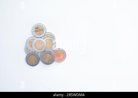 A stack of Mexican one peso coins on a white background Stock Photo - Alamy