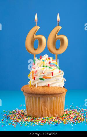 Candle number 66 - Cake birthday in rhodamine red background Stock ...