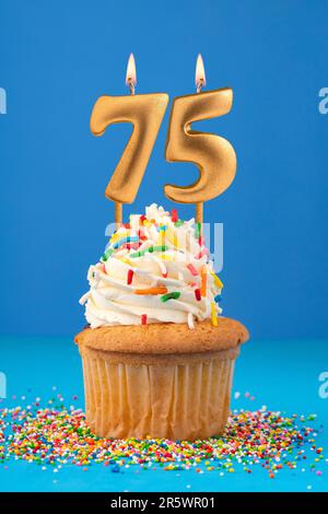 Candle number 75 - Cake birthday in orange background Stock Photo - Alamy