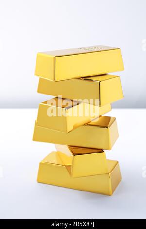 Many shiny gold bars isolated on white Stock Photo - Alamy