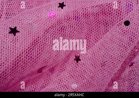 Net Fabric with embellishment of star and circle. Pink colorful netting ...