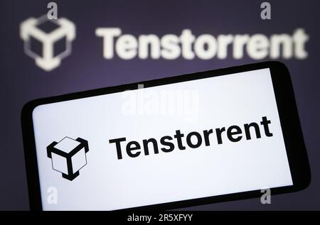 In this photo illustration, Tenstorrent logo seen displayed on a smartphone with tech hardware ...