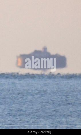 Solent sea-forts appear to be floating or flying above the horizon is ...