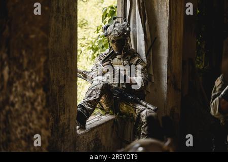 Soldiers running forward and attacking enemy during military operation ...