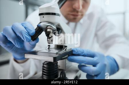 biologist explores the substance under the microscope Stock Photo - Alamy
