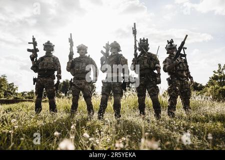 Smart teamwork of soldiers running forward and attacking enemy Stock ...