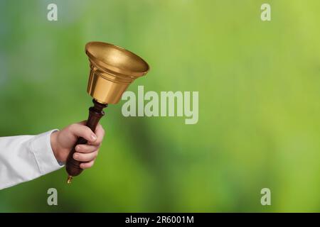 Pupil with school bell outdoors, closeup. Space for text Stock Photo ...