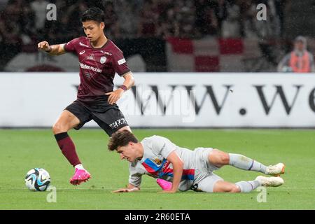 Barcelona's Pablo Torre, left, and Vissel Kobe's Jean Patric battle for ...
