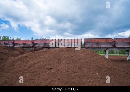 peat transport wagons at the loading point. Raised platform for loading ...