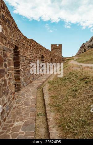 Ancient broken sandstone wall and ble sky Stock Photo - Alamy