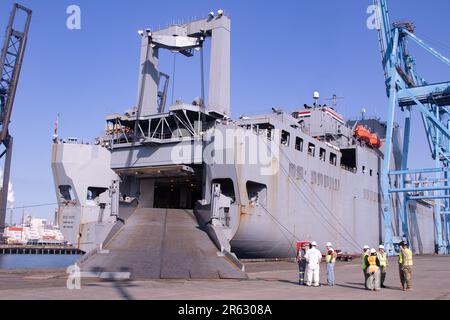 The 833rd transportation battalion loads military equipment onto the ...