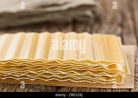 Dry uncooked ridged lasagna pasta sheets, photographed overhead on ...