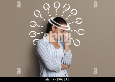 Amnesia concept. Woman trying to remember something. Question marks on ...