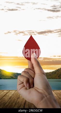 Human hand showing red blood drop. World blood donor day concept Stock ...