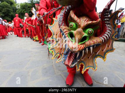 A Yare Dancing Devil shows his mask attached to his chest. Every year ...