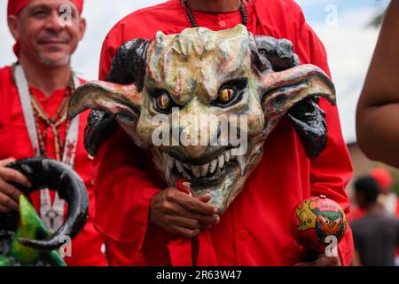 A Yare Dancing Devil shows his mask attached to his chest. Every year ...