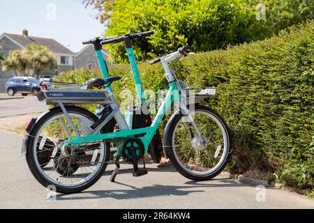 Beryl electric bike and Beryl electric scooters on a street corner in ...