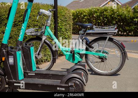 Beryl electric bike and Beryl electric scooters on a street corner in ...