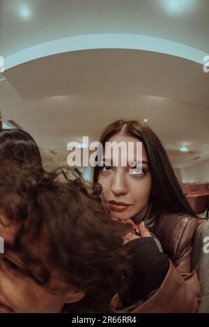 A diverse group of friends with terrified expressions together in a ...