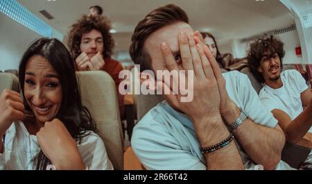 A diverse group of friends with terrified expressions together in a ...