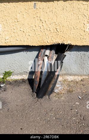 Electrical wires stick out of the ground Stock Photo - Alamy