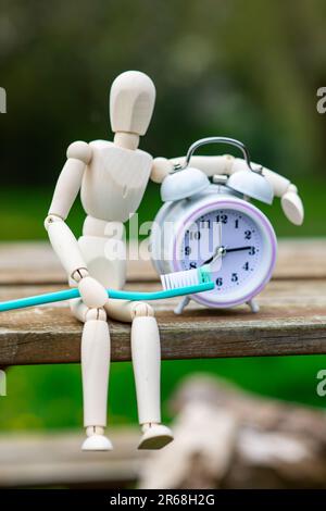 Medicine and healthcare concept. A human figurine pushes a blue wooden ...