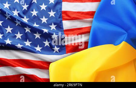 National flags of Ukraine and USA symbolizing partnership between ...
