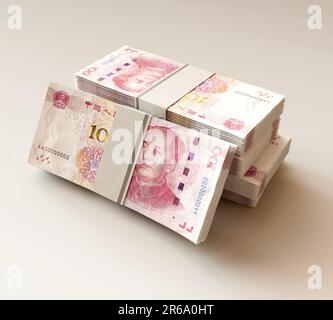 A stack of bundled chinese yuan banknotes on an isolated light ...