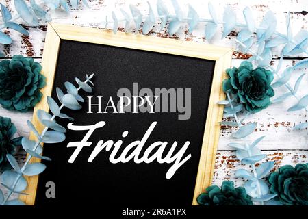Happy Friday typography text with flower decoration on wooden ...