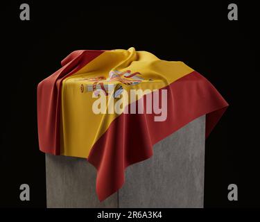 A spain flag draped over a stone plinth on an isolated dark studio ...