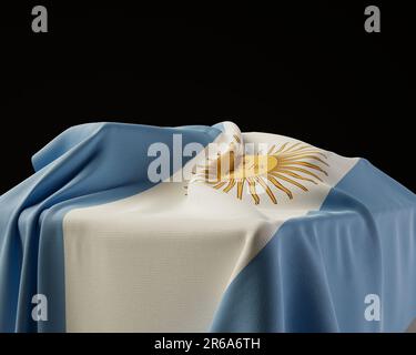 A argentina flag draped over a stone plinth on an isolated dark studio ...