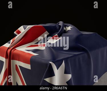 A australia flag draped over a stone plinth on an isolated dark studio ...