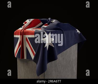 A australia flag draped over a stone plinth on an isolated dark studio ...