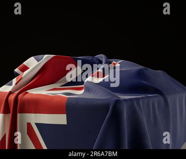 A new zealand flag draped over a stone plinth on an isolated dark ...